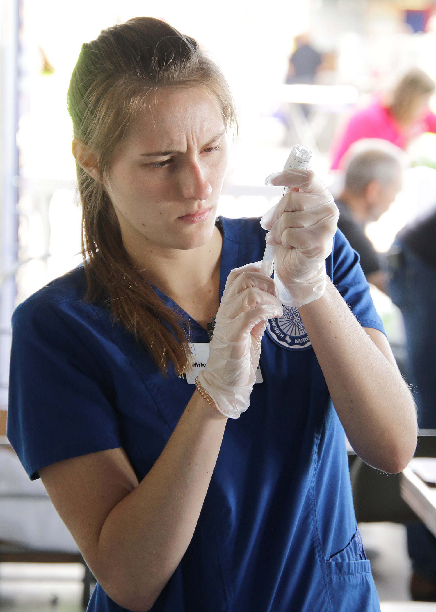 Mikayla Overkamp draws up flu vac for veterans who are waiting for flu ...